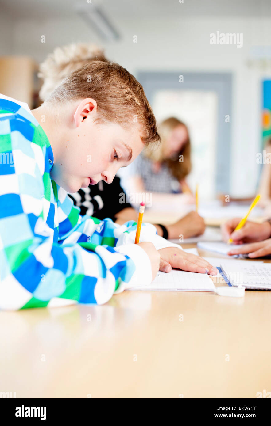 Boy writing with right hand hi-res stock photography and images - Alamy
