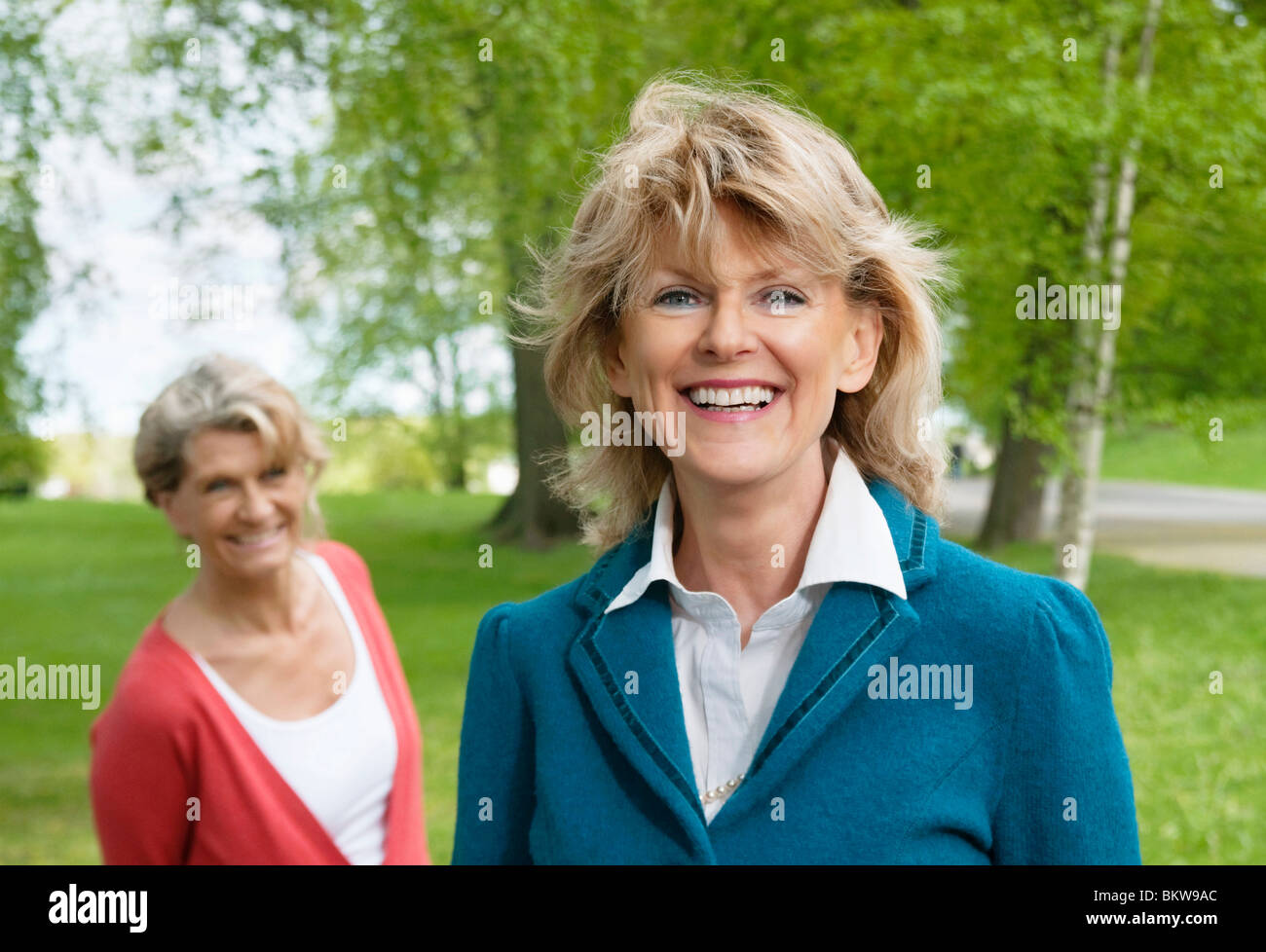 Two grown-up women in the park Stock Photo - Alamy