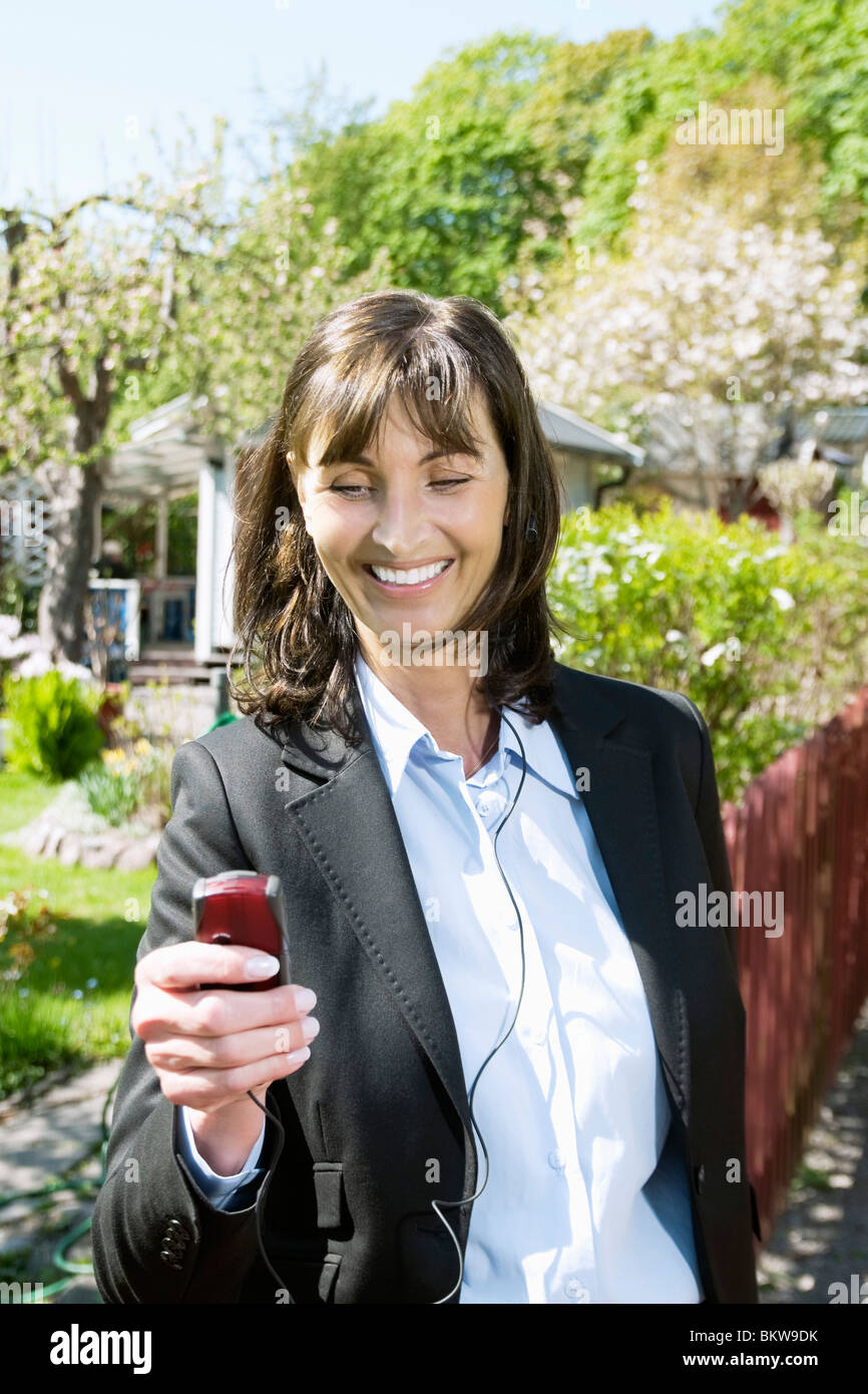 Woman looking at telephone Stock Photo - Alamy