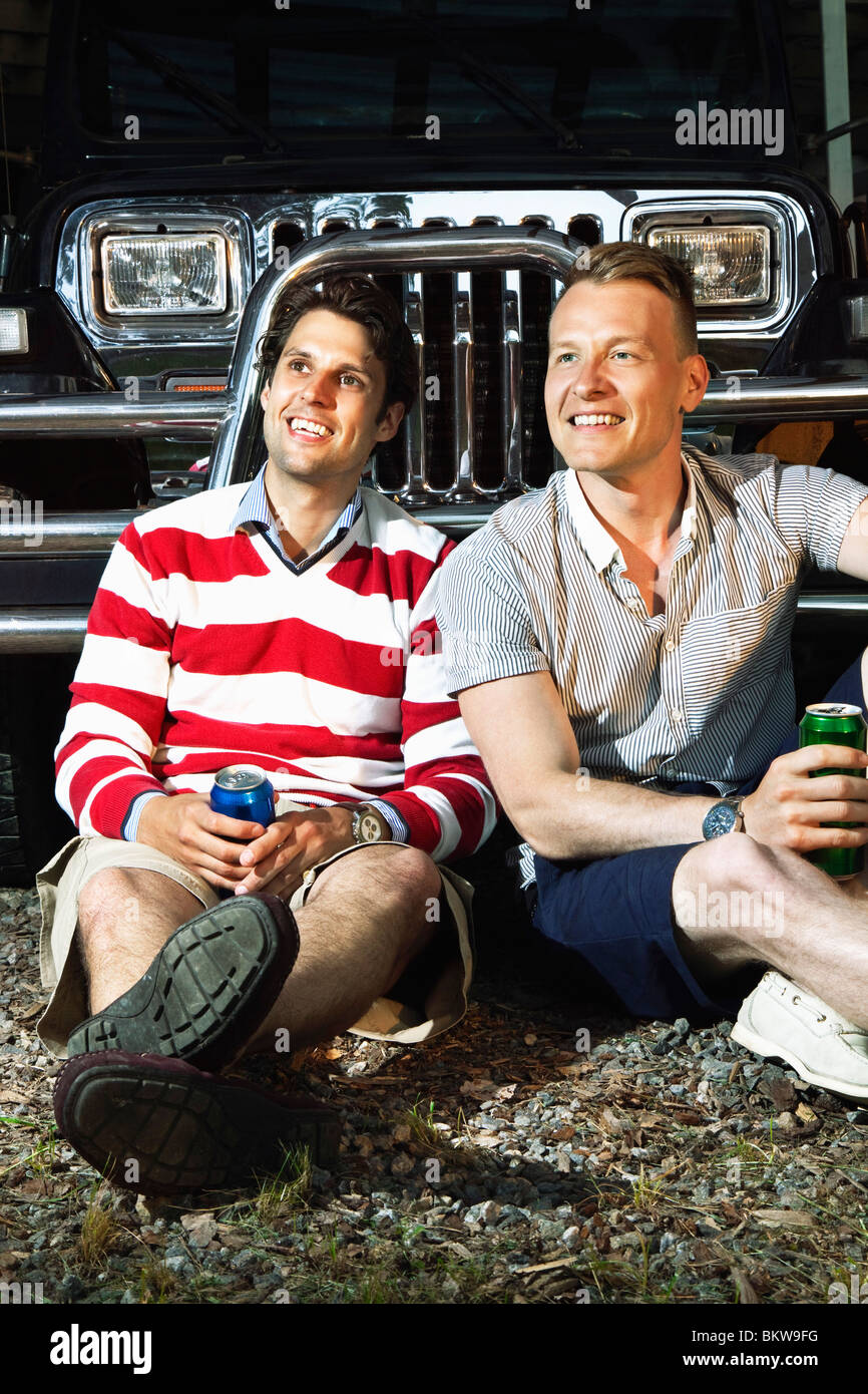 Friends in front of car Stock Photo - Alamy