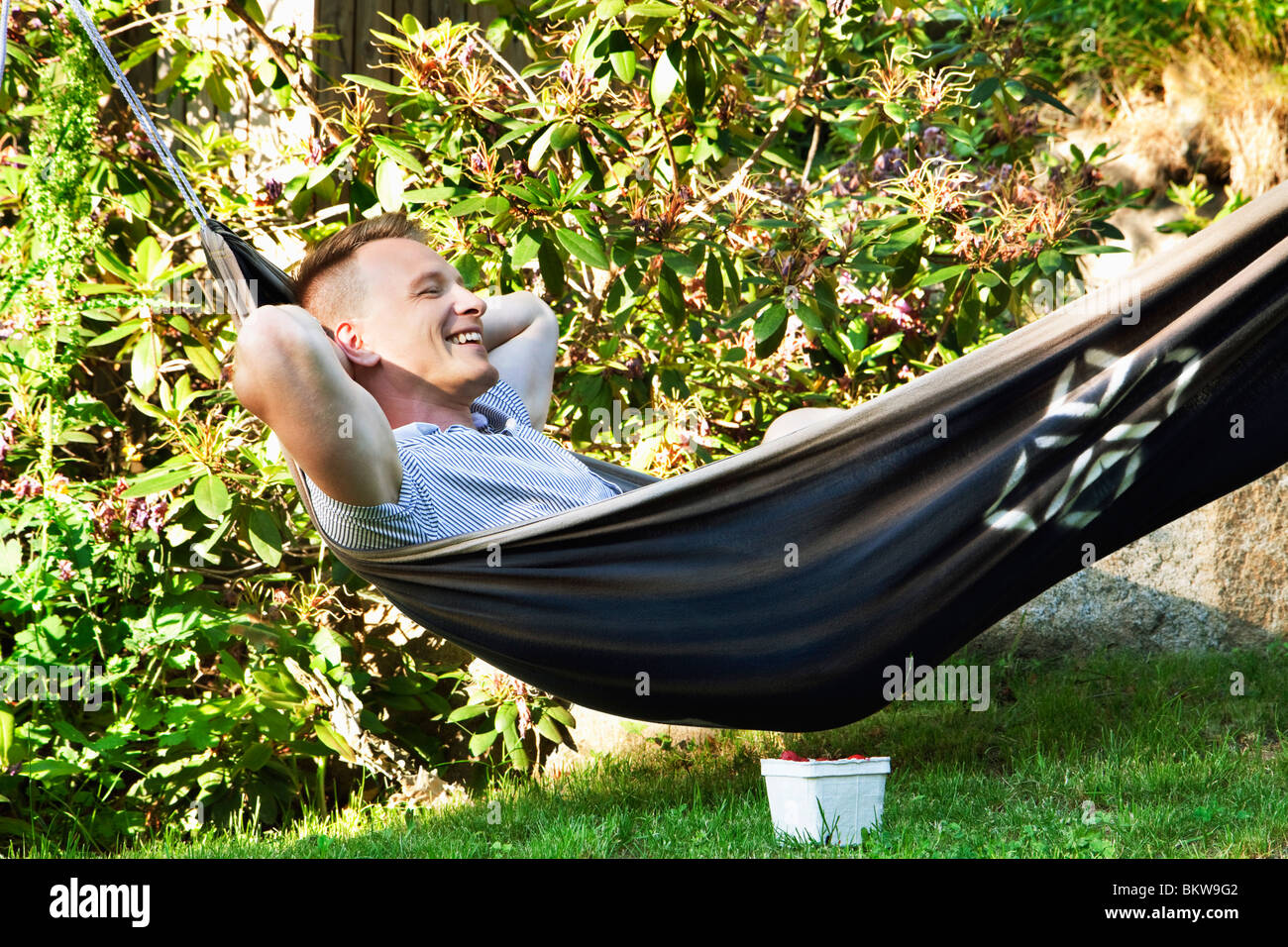 Man in hammock Stock Photo - Alamy