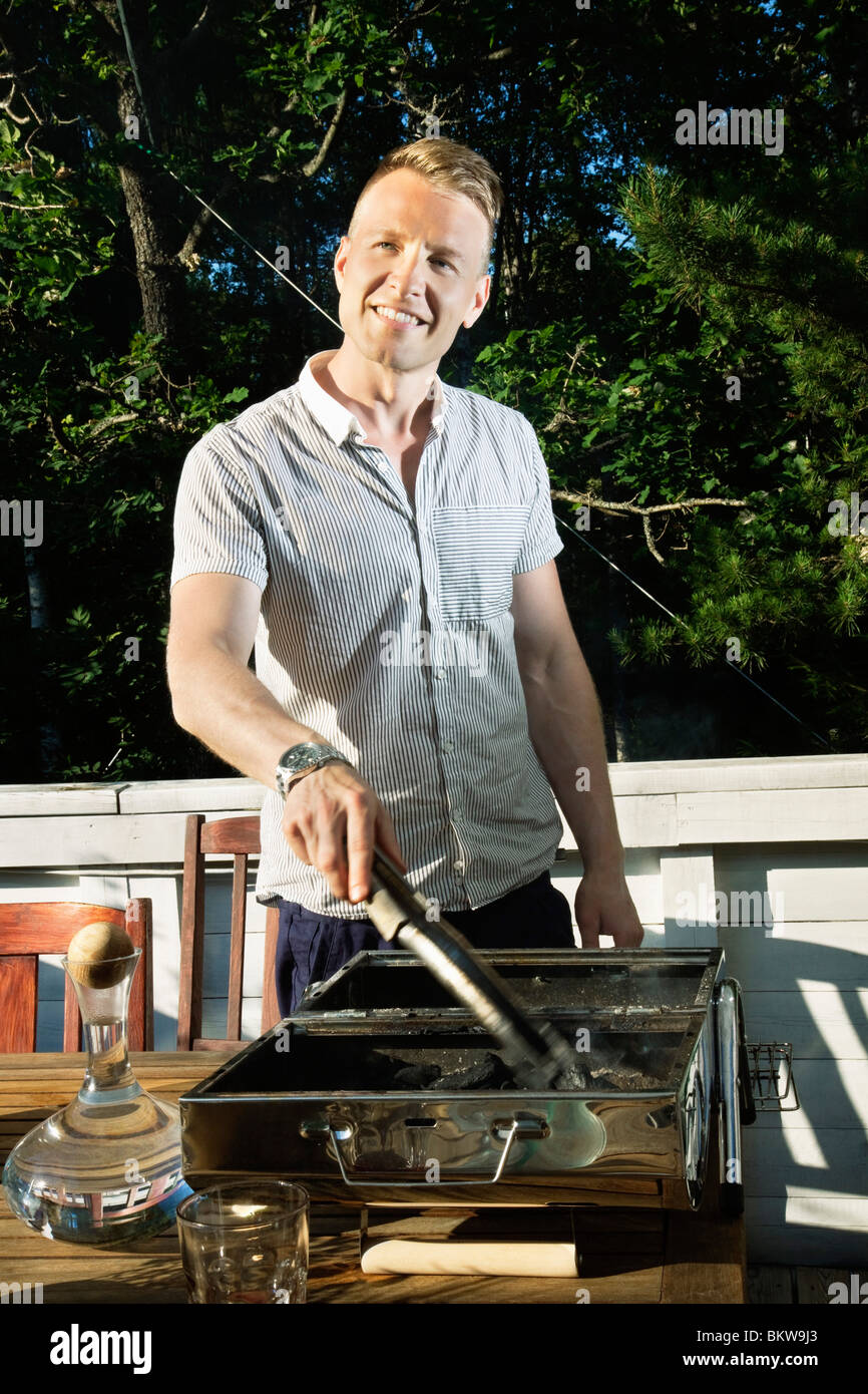 Happy man at the grill Stock Photo - Alamy