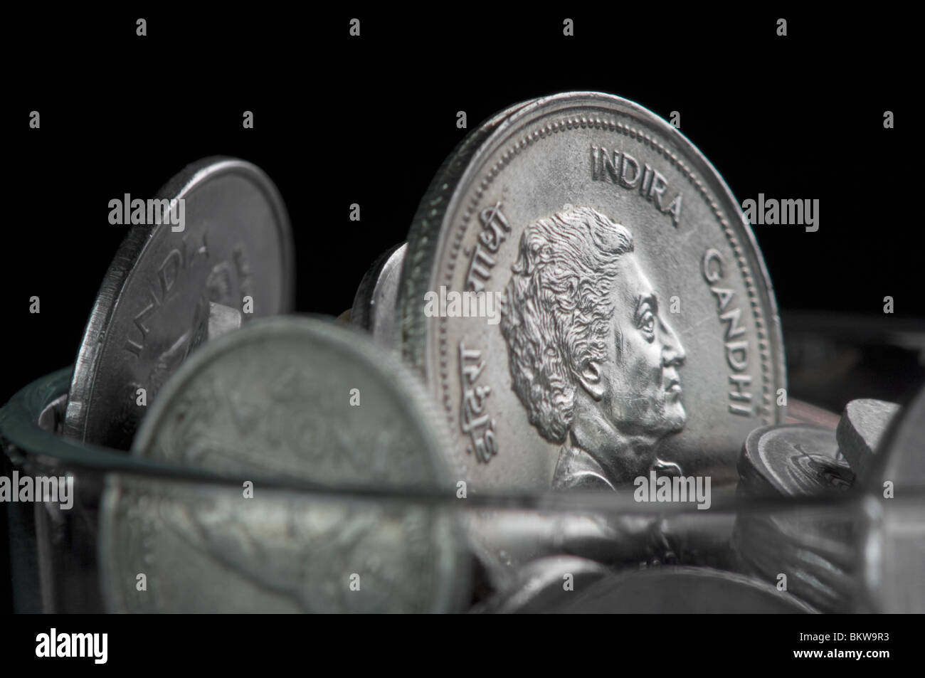 Indian rupee coins in a glass container Stock Photo - Alamy