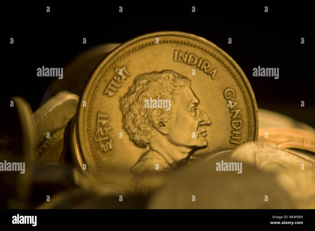 Indian rupee coins in a glass container Stock Photo - Alamy