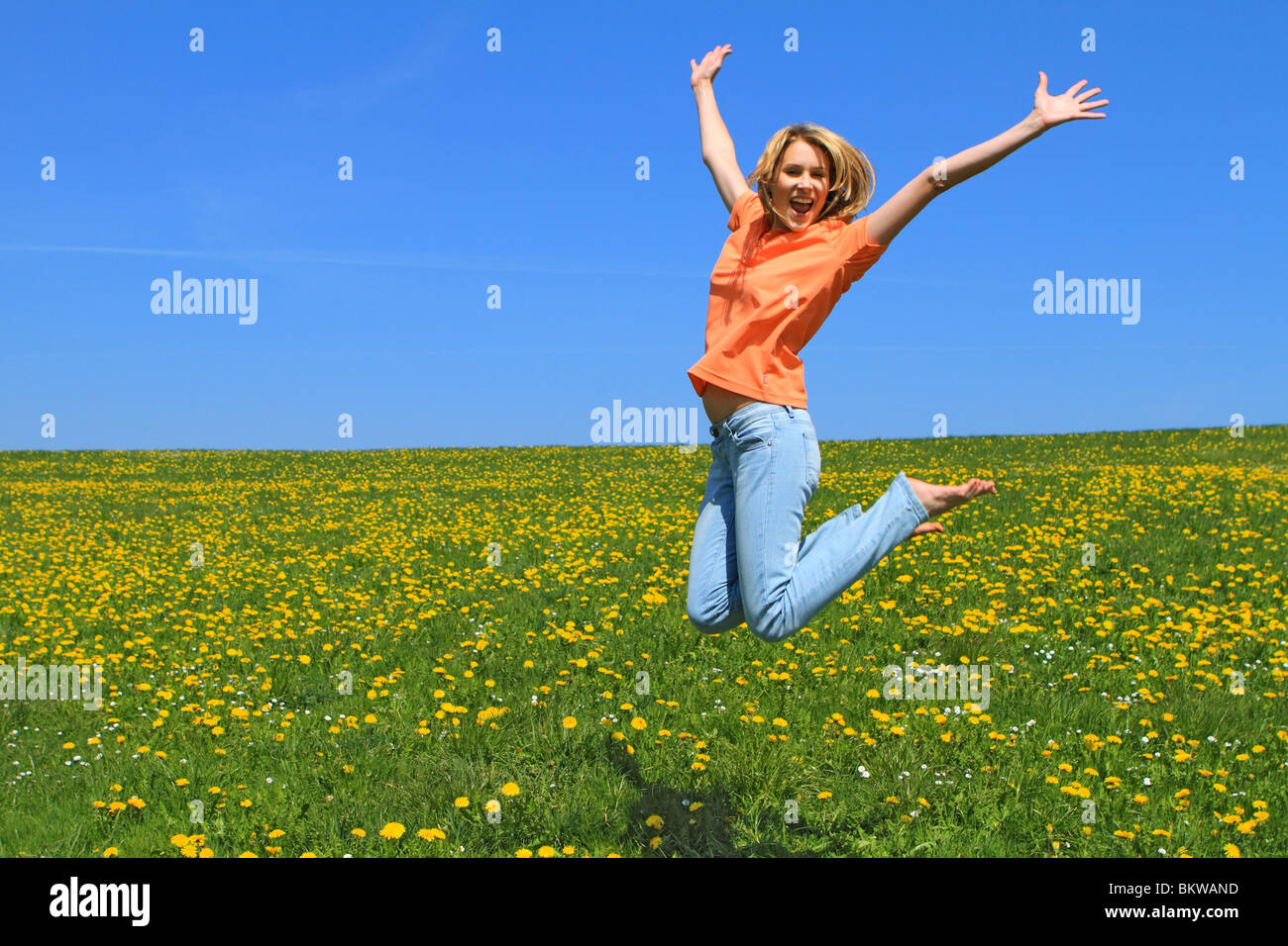 Happy young woman in spring Stock Photo - Alamy