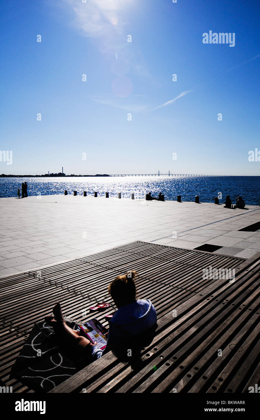 Woman sunbathing reading magazine hi-res stock photography and images ...