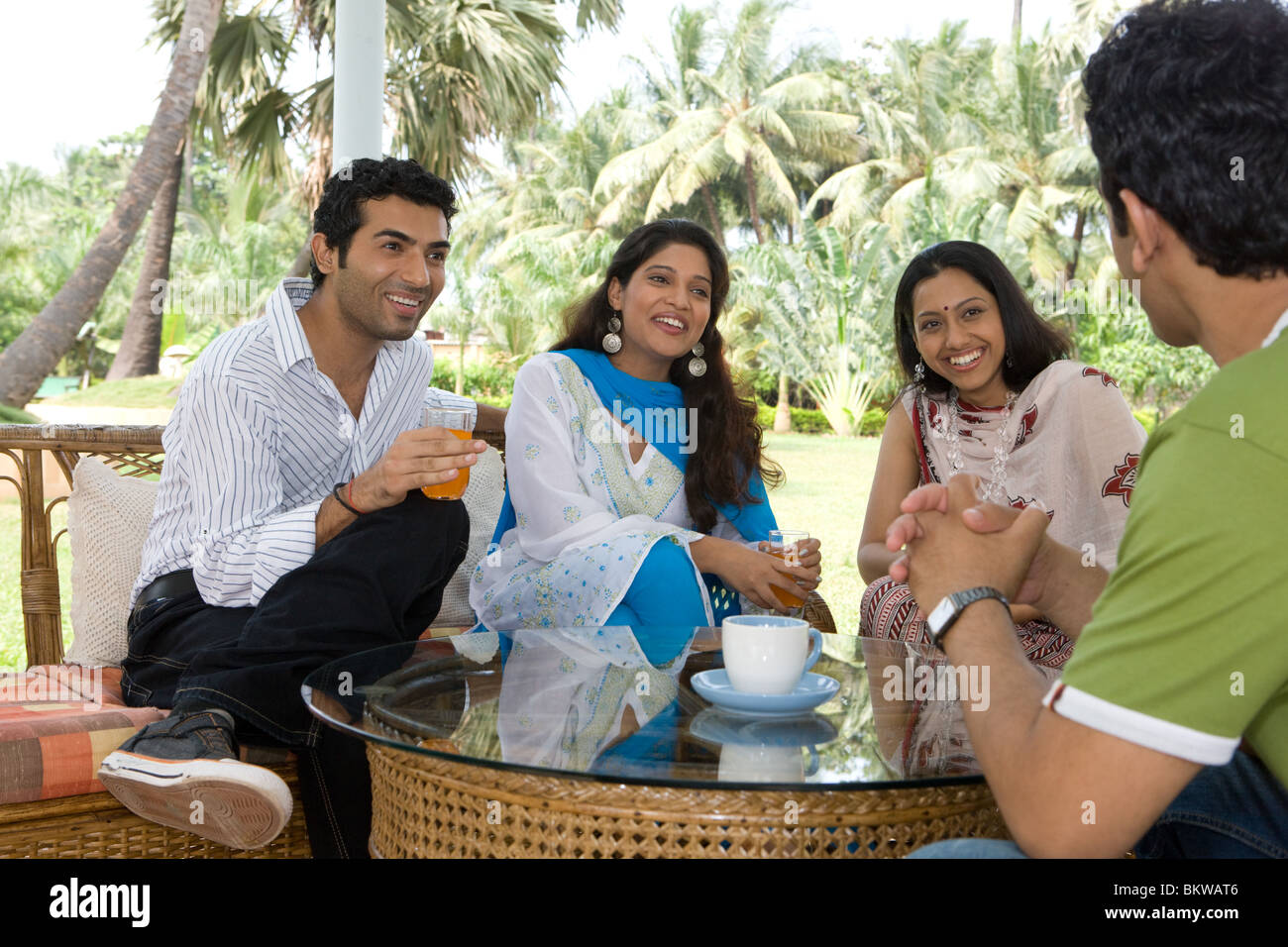 Four people talking hi-res stock photography and images - Alamy