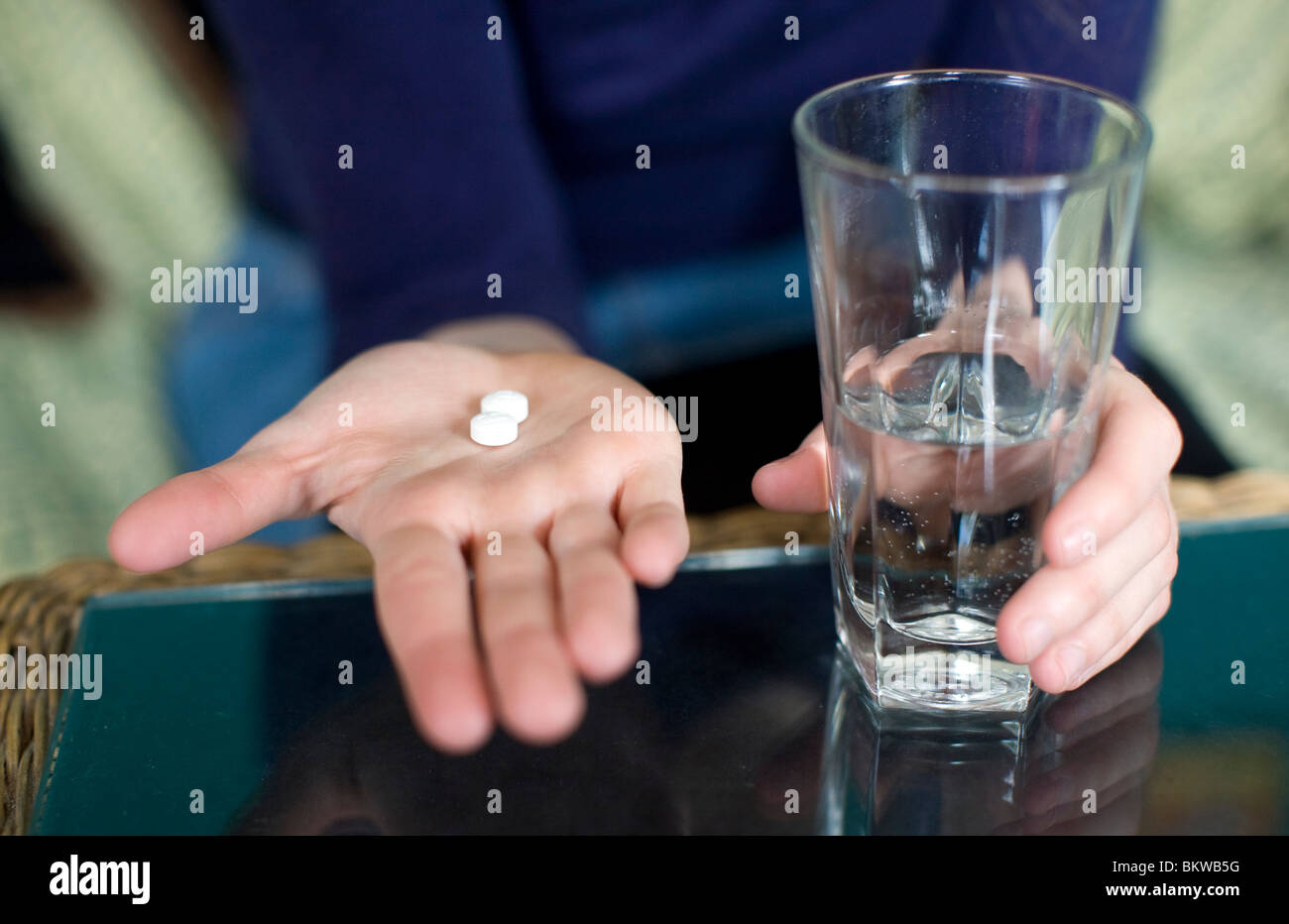 Person taking medication, London: MODEL RELEASED Stock Photo - Alamy