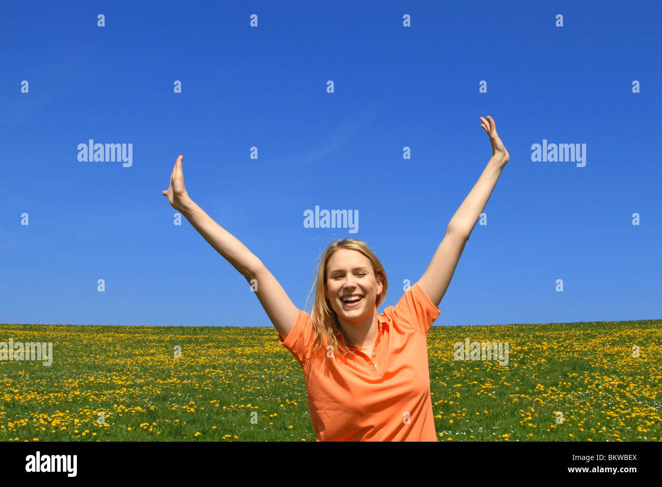Happy young woman in spring Stock Photo - Alamy