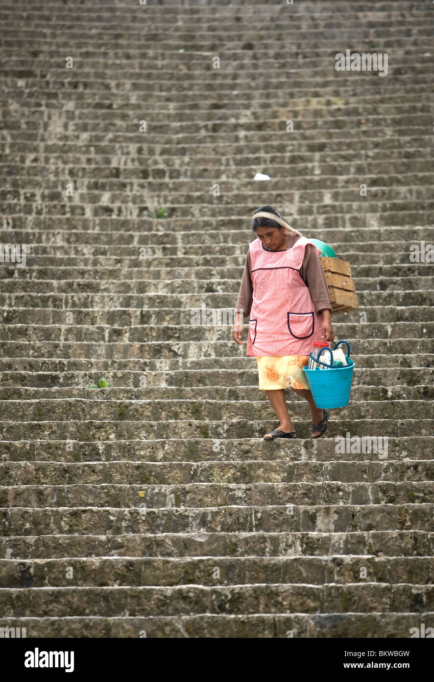 A Nahuatl indigenous woman descends some stairs in Cuetzalan del ...