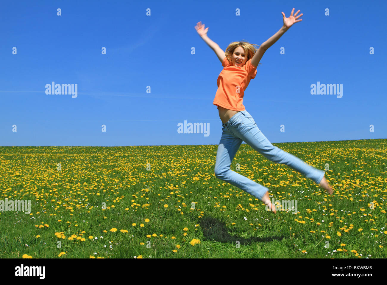 Happy young woman in spring Stock Photo - Alamy