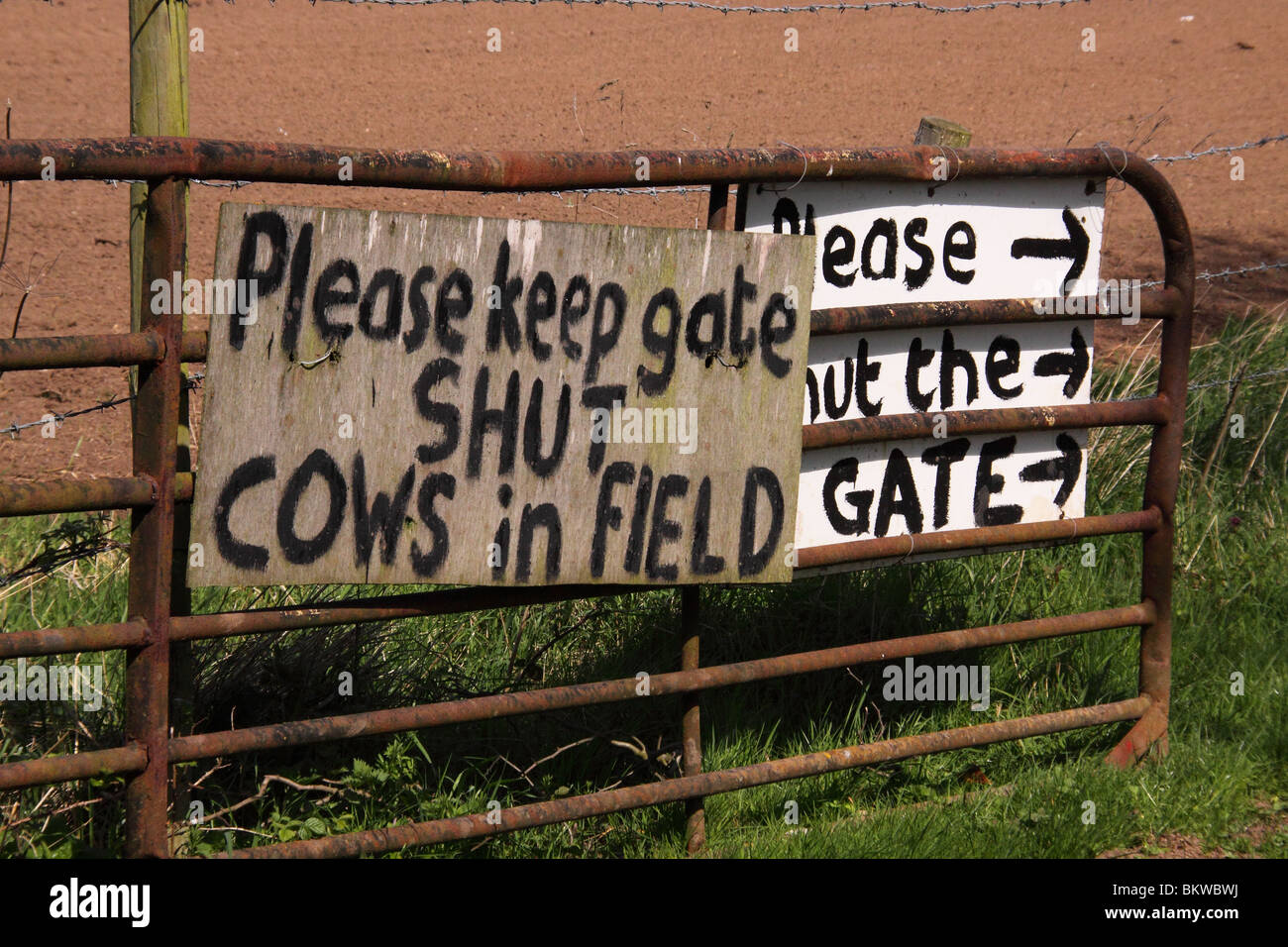 Old Rusty Gate with signs saying please shut the gate cows in field ...