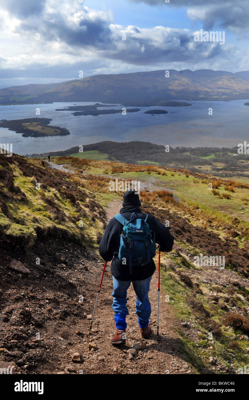 Active elderly people go hill walking in the Trossachs National Park ...