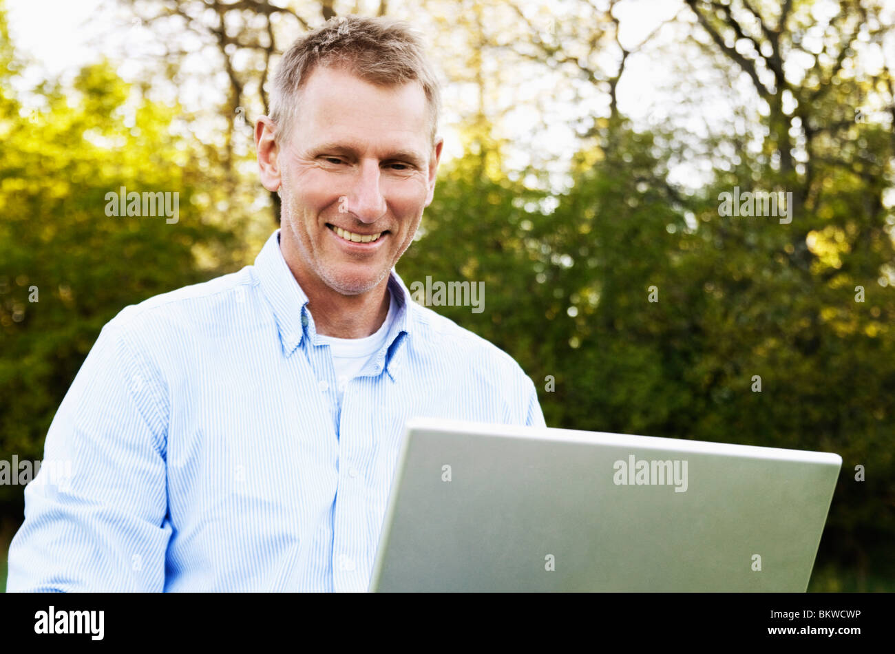 Man with laptop Stock Photo - Alamy