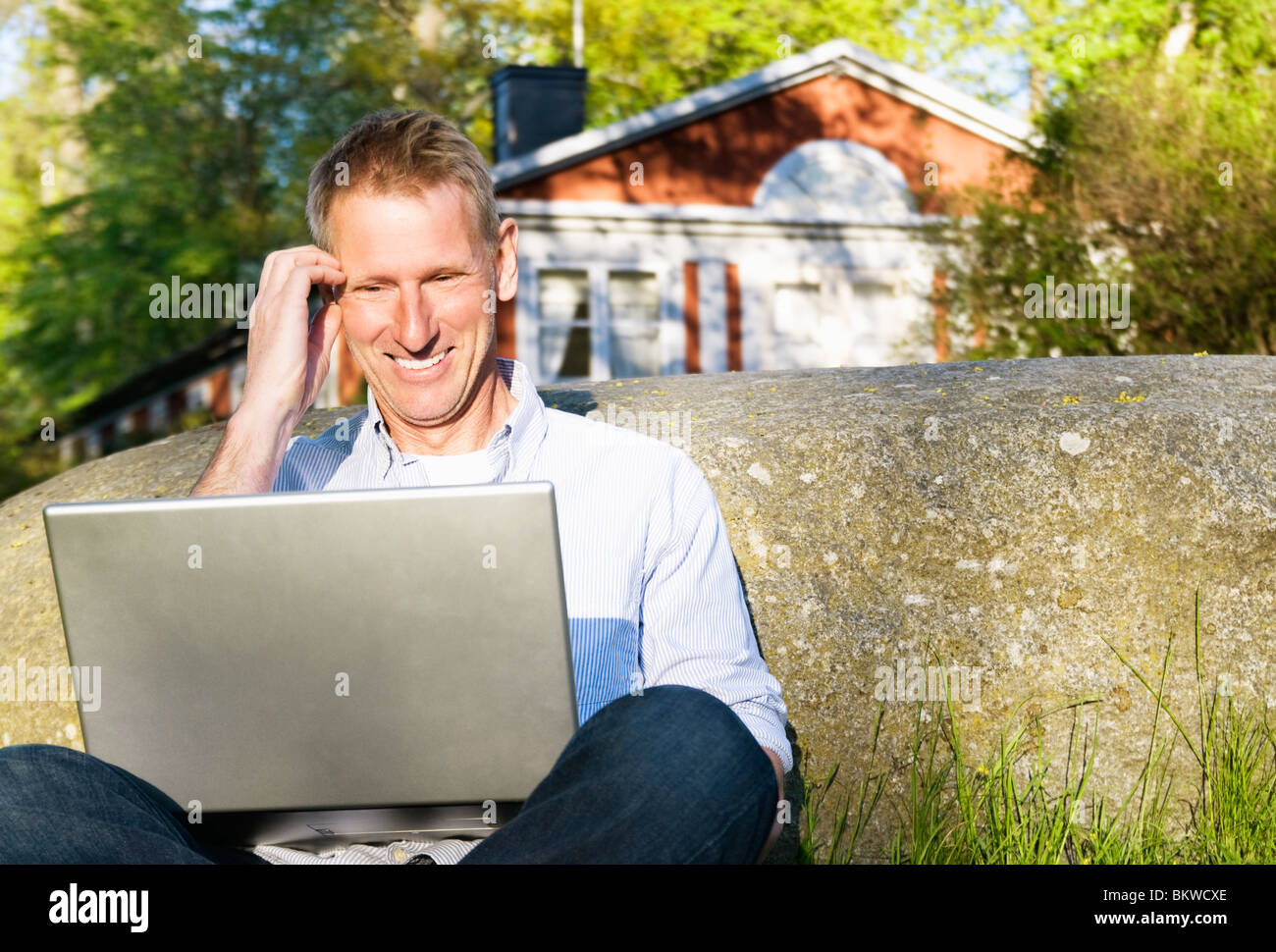 Man working outside Stock Photo - Alamy