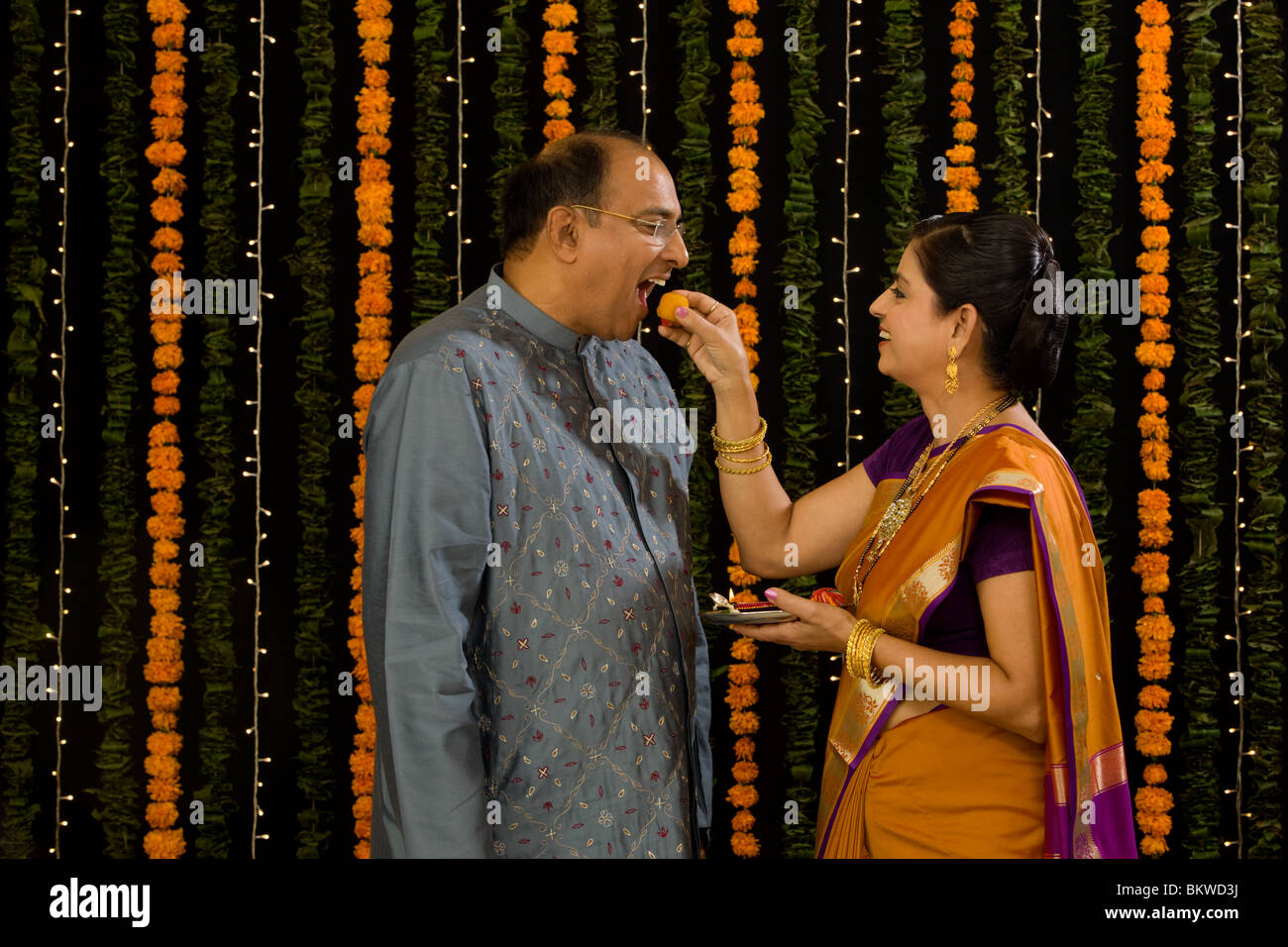 Senior Indian couple celebrating diwali Stock Photo - Alamy