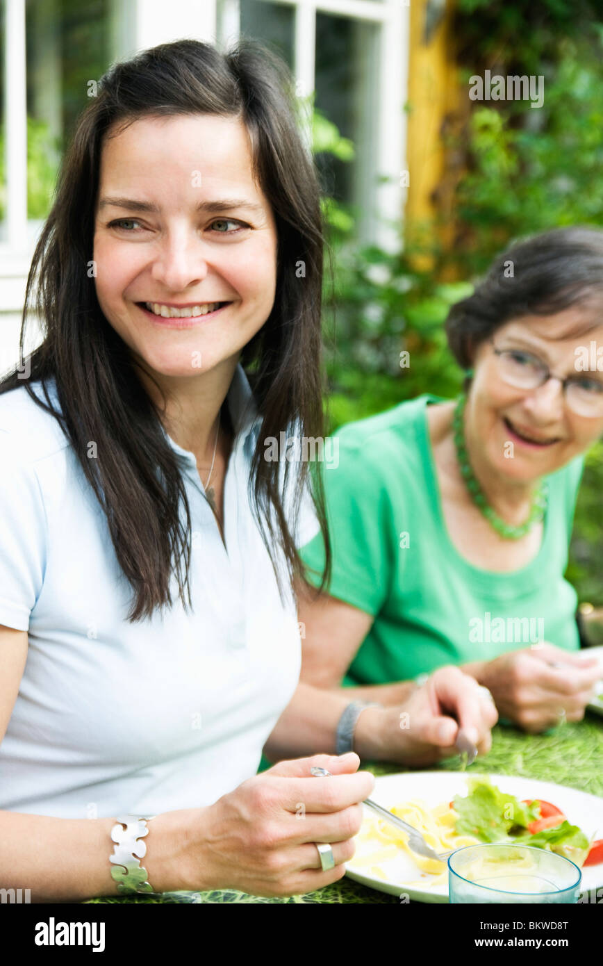 Women at dinnertable Stock Photo - Alamy