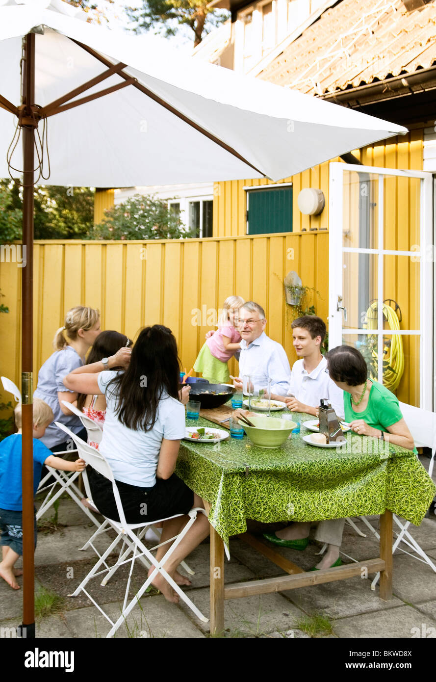 Family dinner outside Stock Photo - Alamy