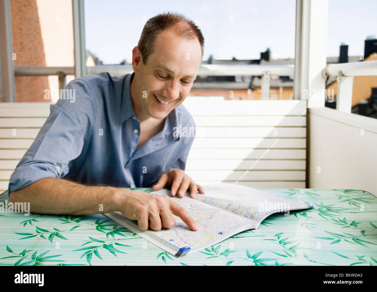 Man at table Stock Photo - Alamy
