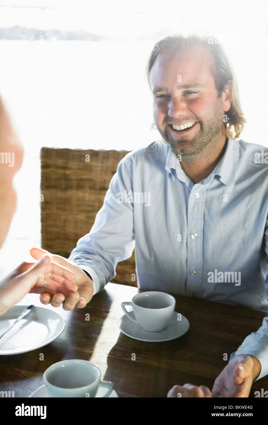 Closeup on men holding hands Stock Photo - Alamy