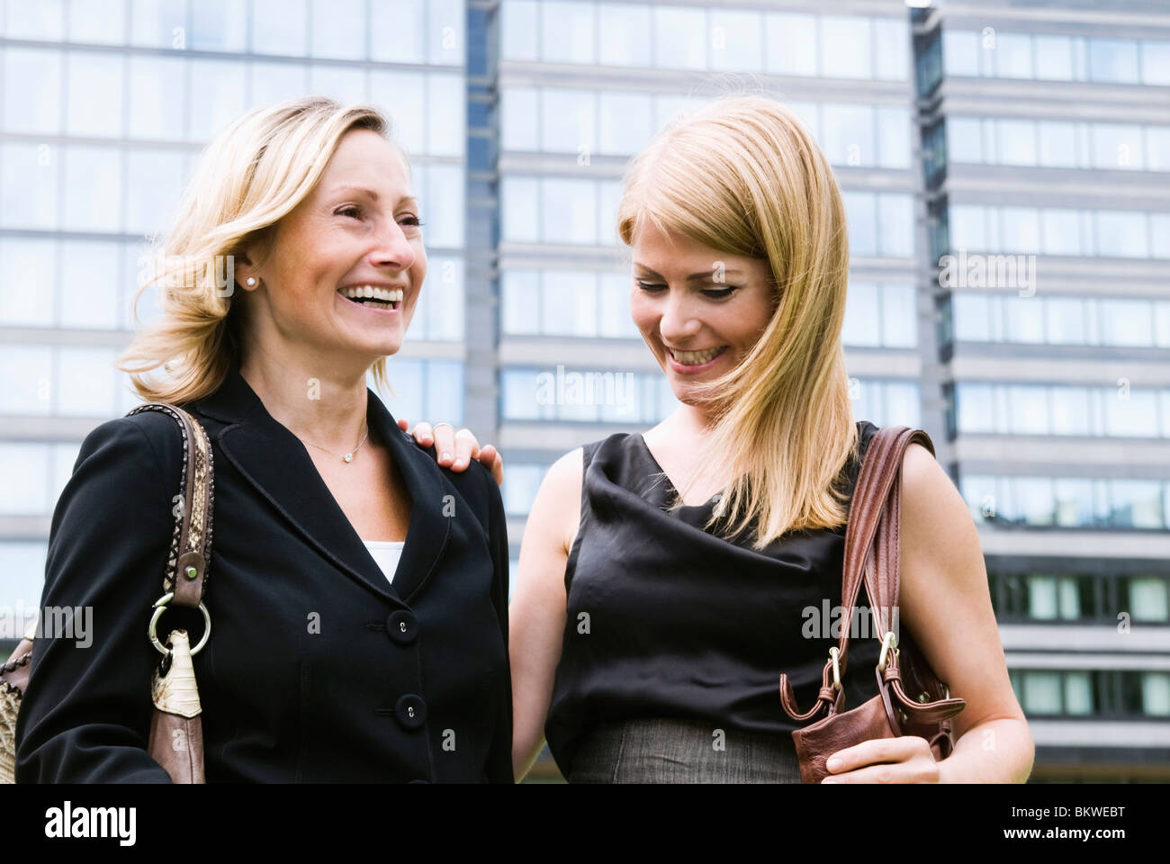 Business partners walking outside talking hi-res stock photography and ...