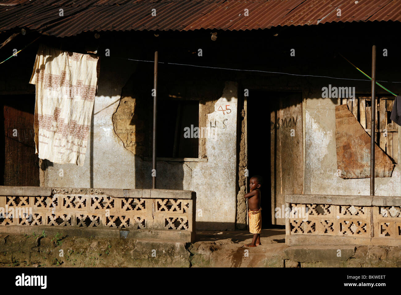 Child outside house in the village of Bumbuna, Sierra Leone, West ...