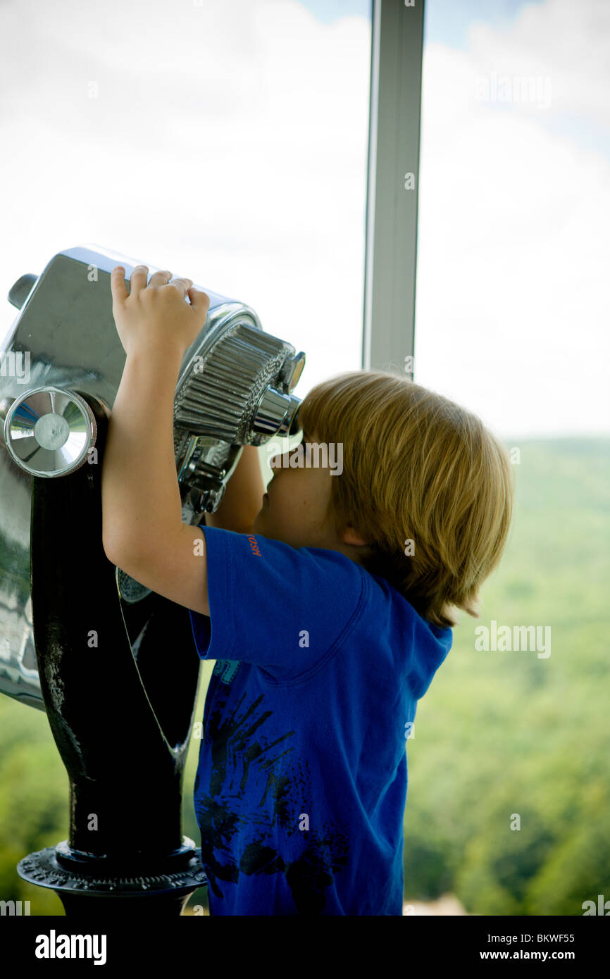 A child looks through a scope Stock Photo - Alamy