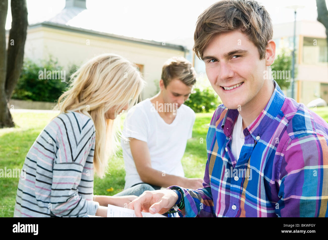 three students outdoors Stock Photo - Alamy