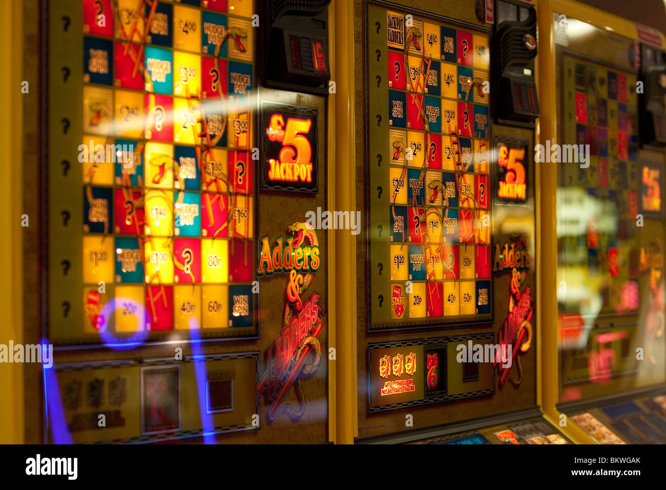 Illuminated Slot Gambling machines in an amusement arcade Stock Photo ...