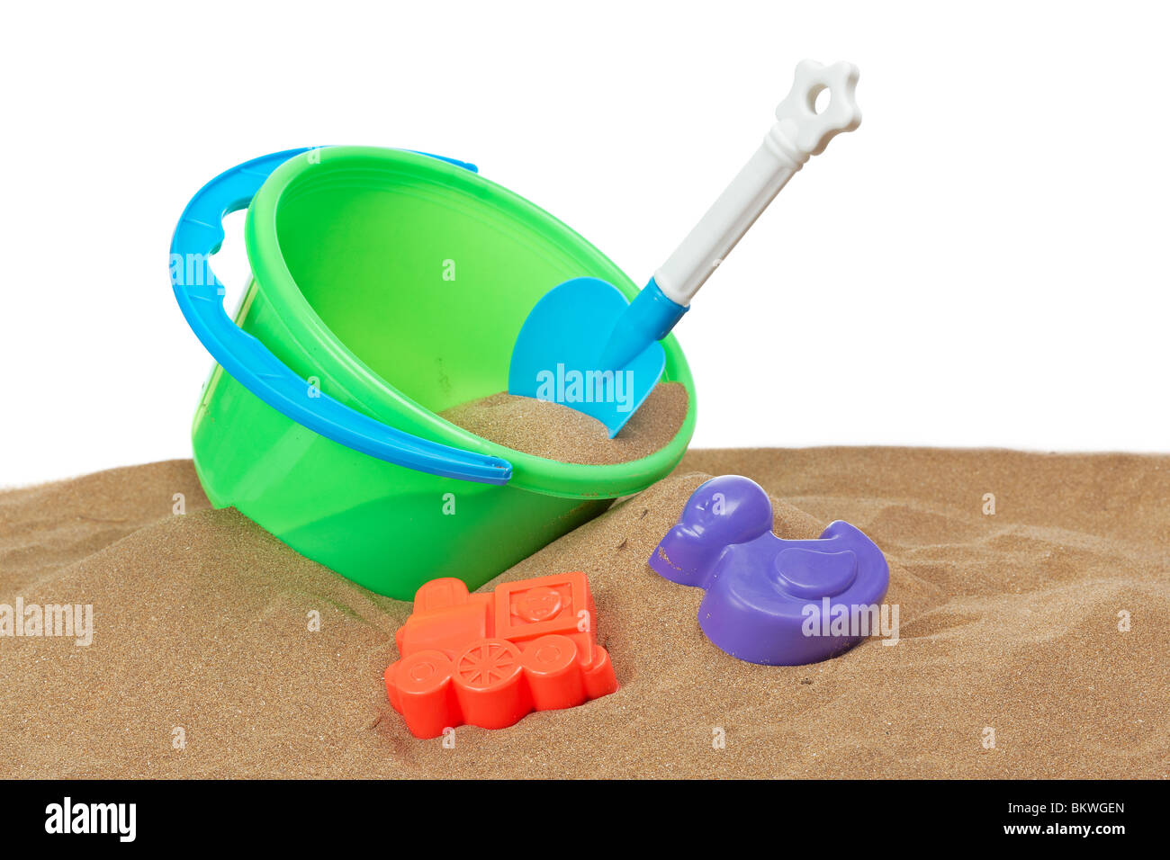 Bucket full and shovel on the sand with copy space on a white ...