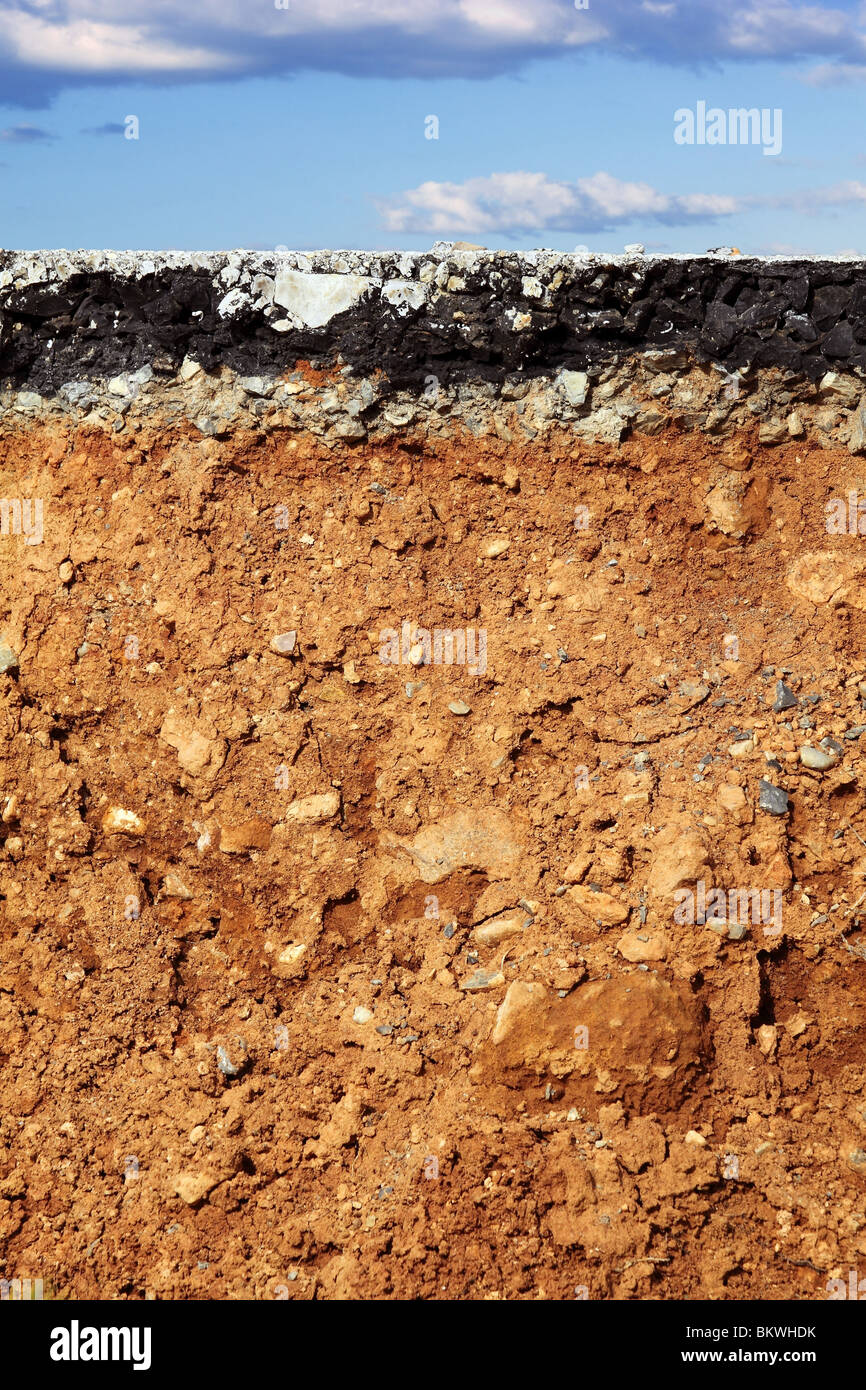 broken asphalt road excavation earthquake cross section blue sky Stock ...