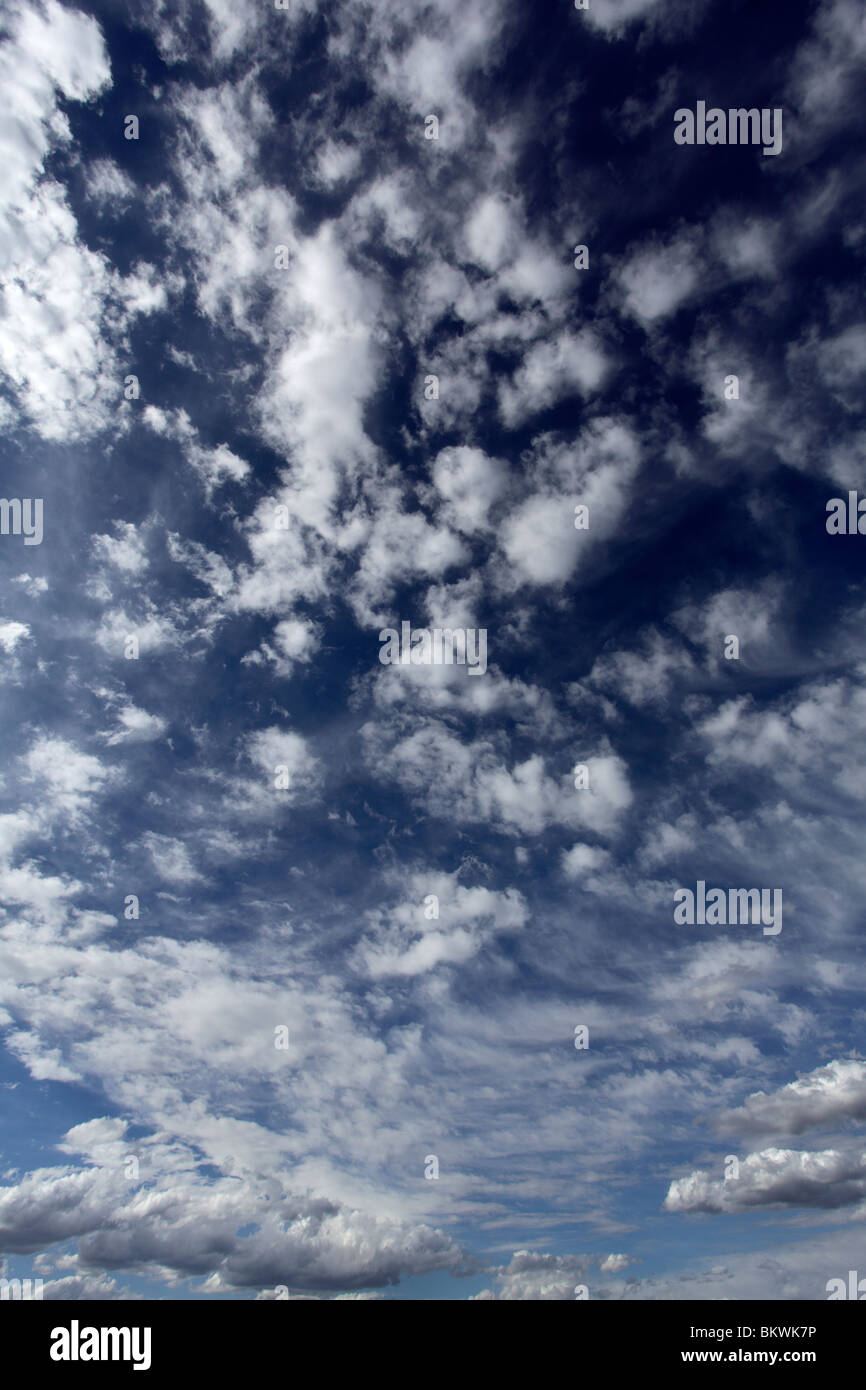 Blue sky with patchy clouds Stock Photo - Alamy