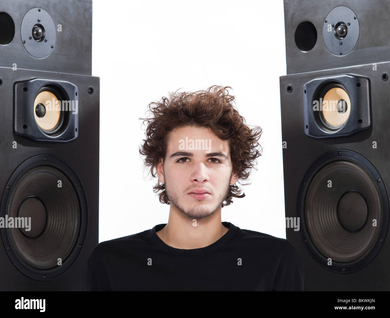 studio portrait of a one caucasian young man listening to music lover ...