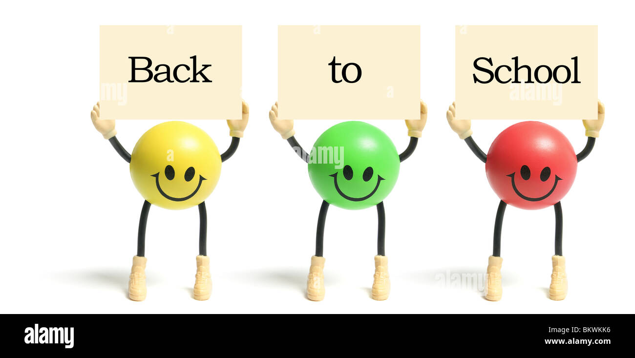 Smiley Toys Holding Back To School Notice Stock Photo - Alamy