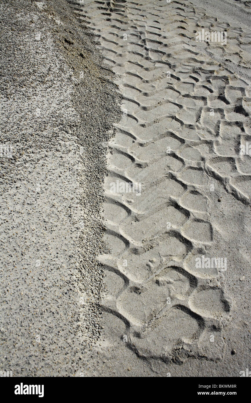 excavator tyres footprint on quarry white sand pattern Stock Photo - Alamy