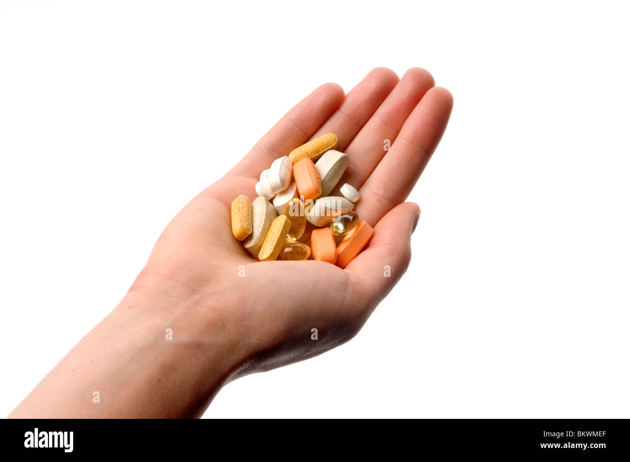 hand holding pills Stock Photo - Alamy