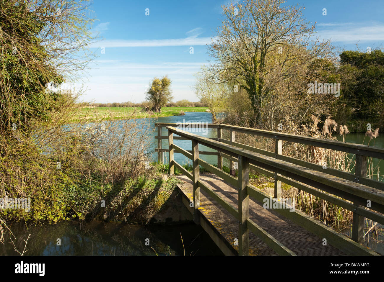 Wooden footbridge on the Thames Path above Rushey Lock and weir ...