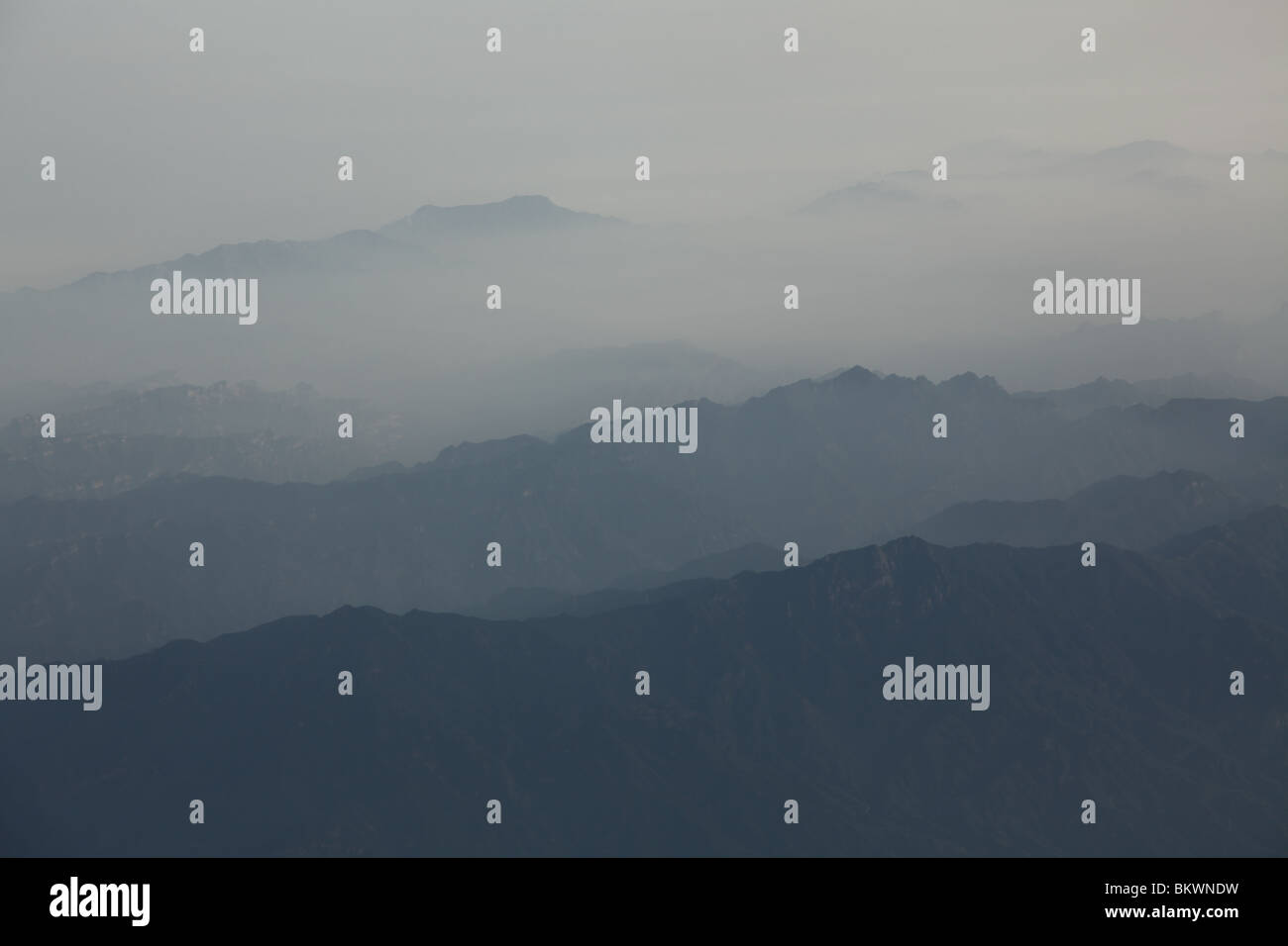 Mountains in the mist Stock Photo - Alamy