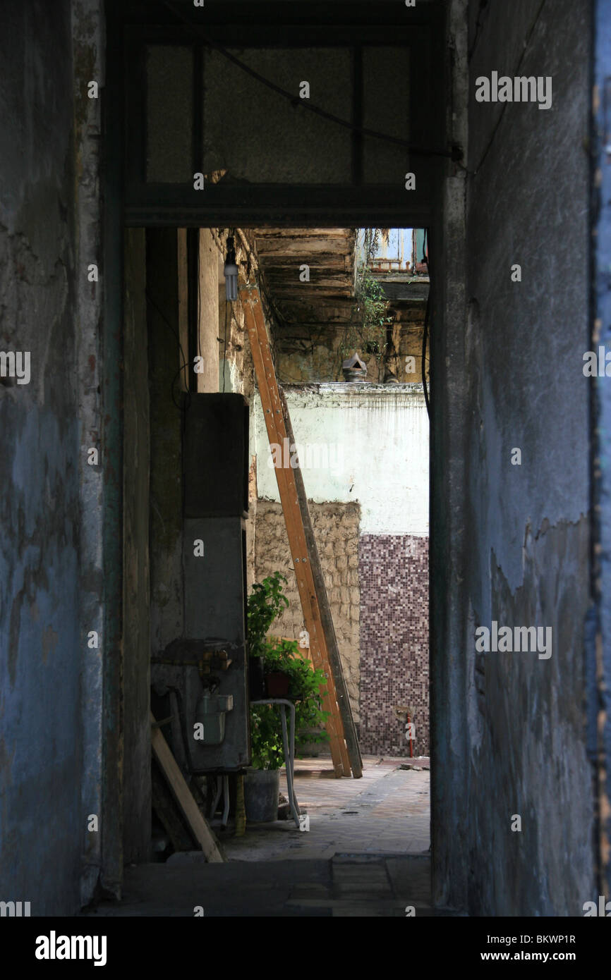 A wooden step ladder at the end of an alley Stock Photo - Alamy