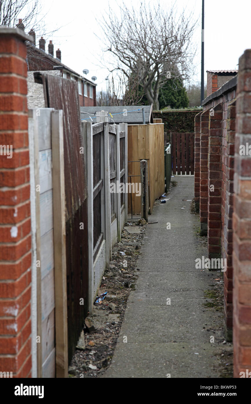 Typical alley behind social housing on estate Stock Photo - Alamy