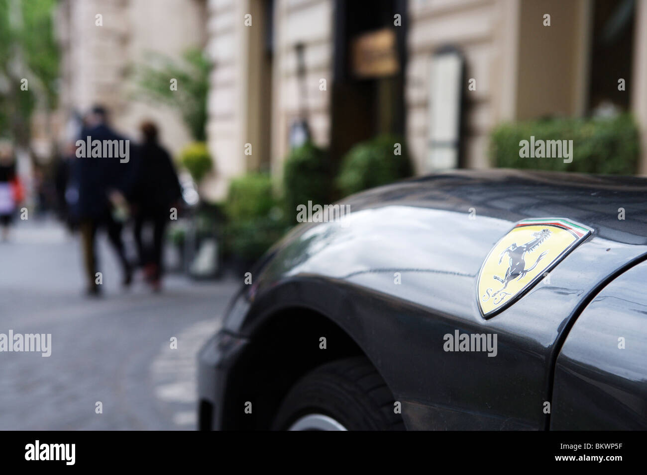 A Ferrari is parked in front of a luxury hotel in Rome Italy Stock ...