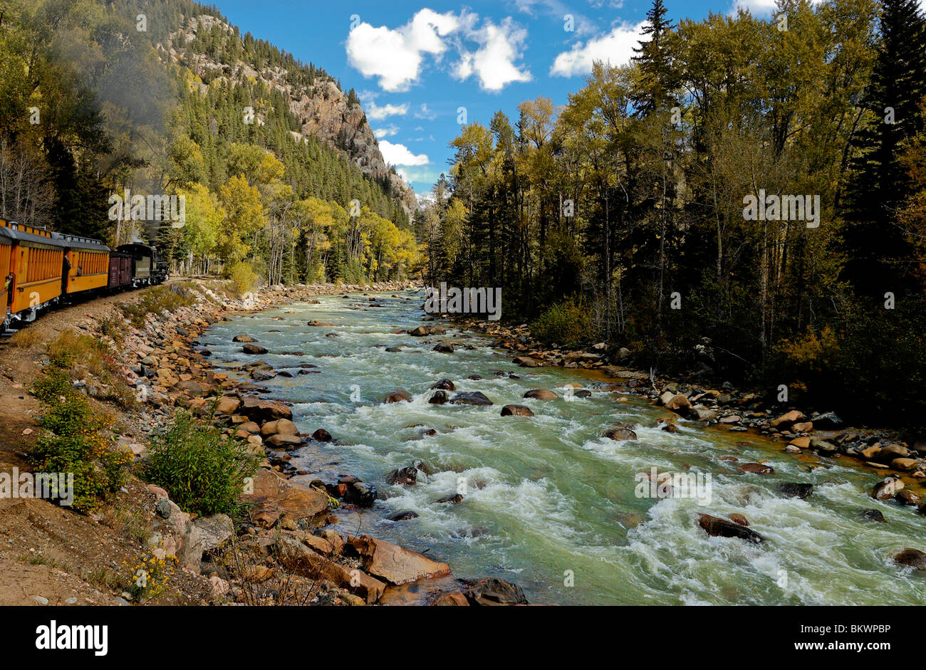 Stock photograph of a steam train running along the Animas river ...