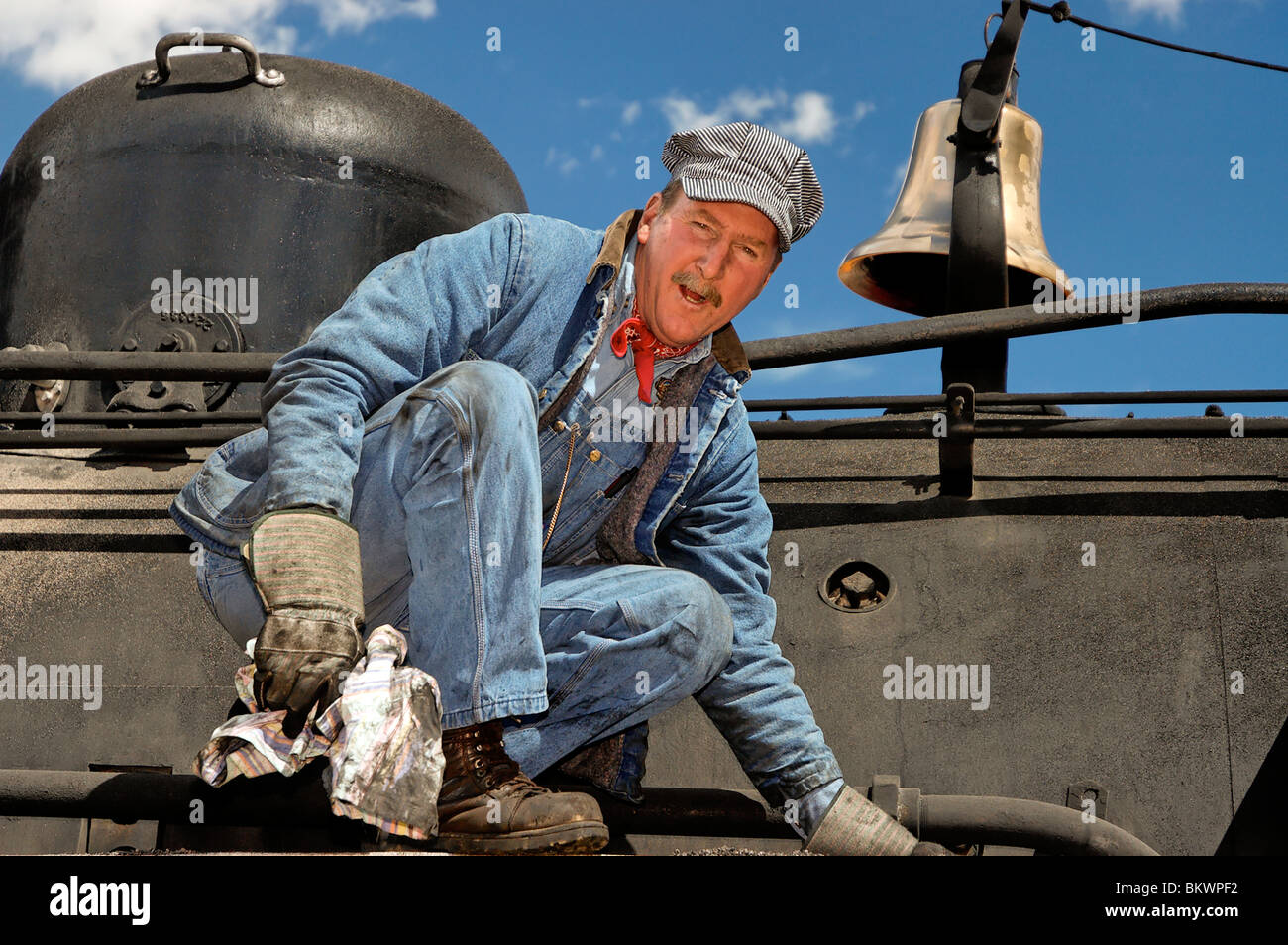 Stock photo of engineer cleaning coal cinders off locomotive,Durango ...