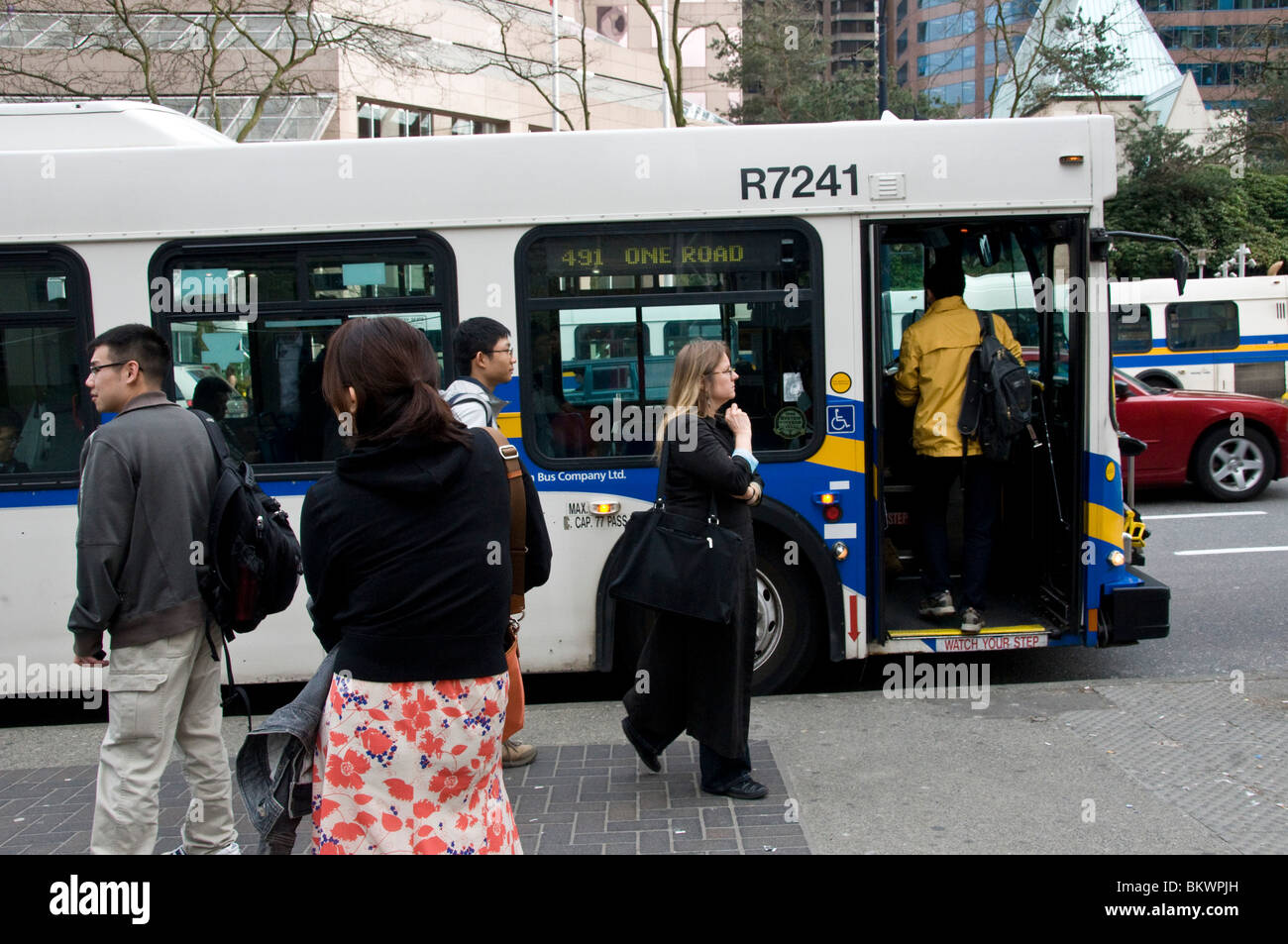 Commuters Taking the bus downtown Vancouver Stock Photo - Alamy