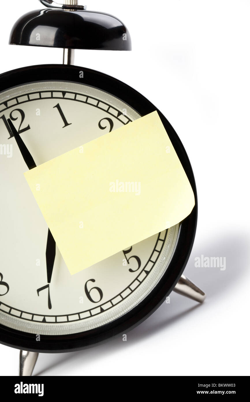 the alarm clock with note paper on white background Stock Photo - Alamy