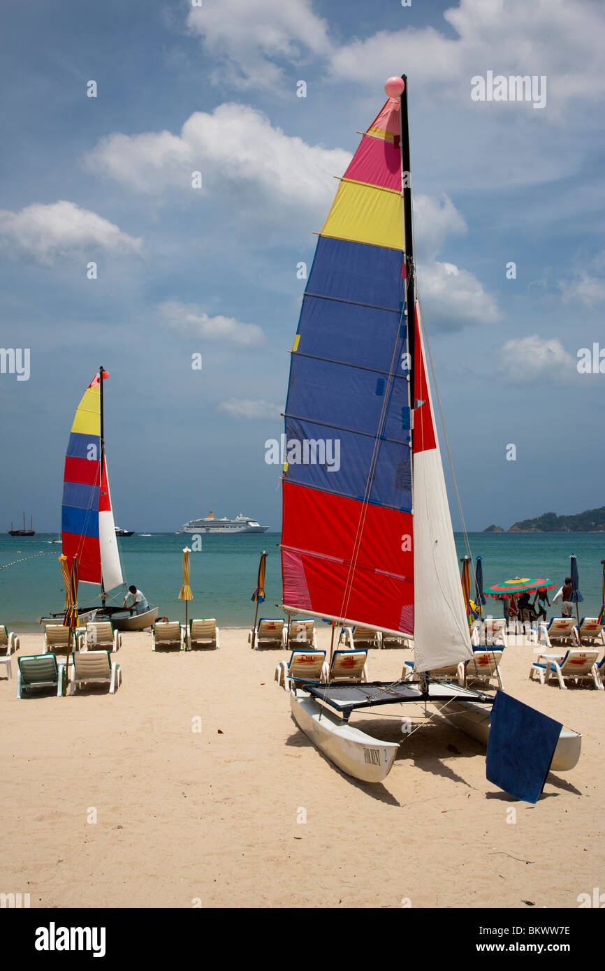 boats on beach with colourful sails Stock Photo - Alamy
