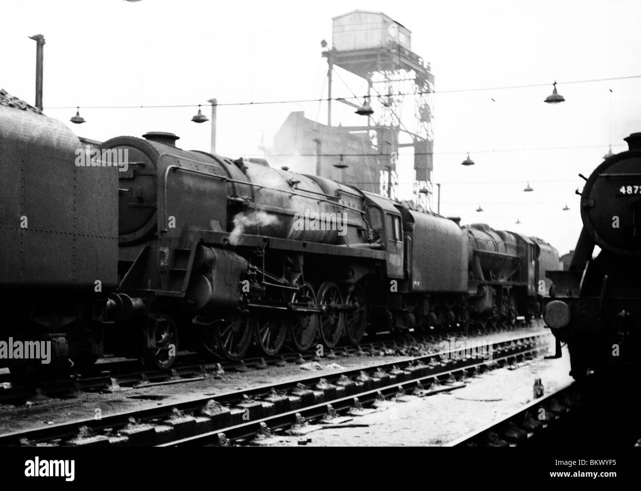 a britannia pacific 7mt class engine steams at a depot during the final ...