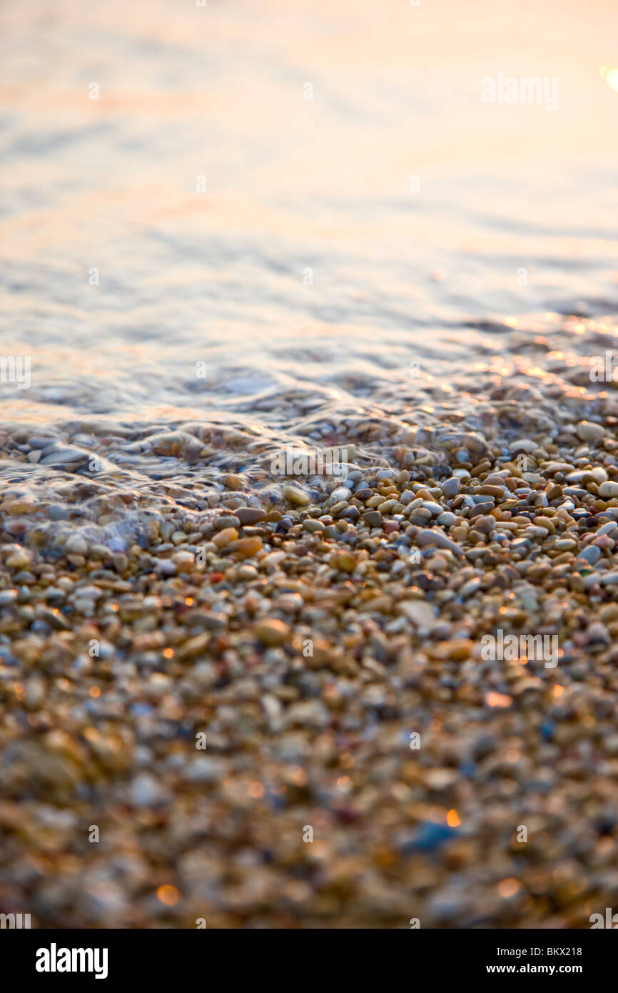 Pebbles and sea water Stock Photo - Alamy