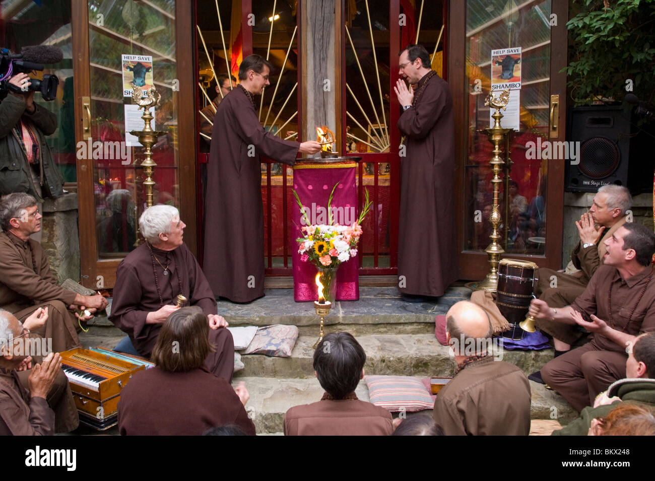 Monks chanting and praying outside the stall of sacred bull SHAMBO at ...