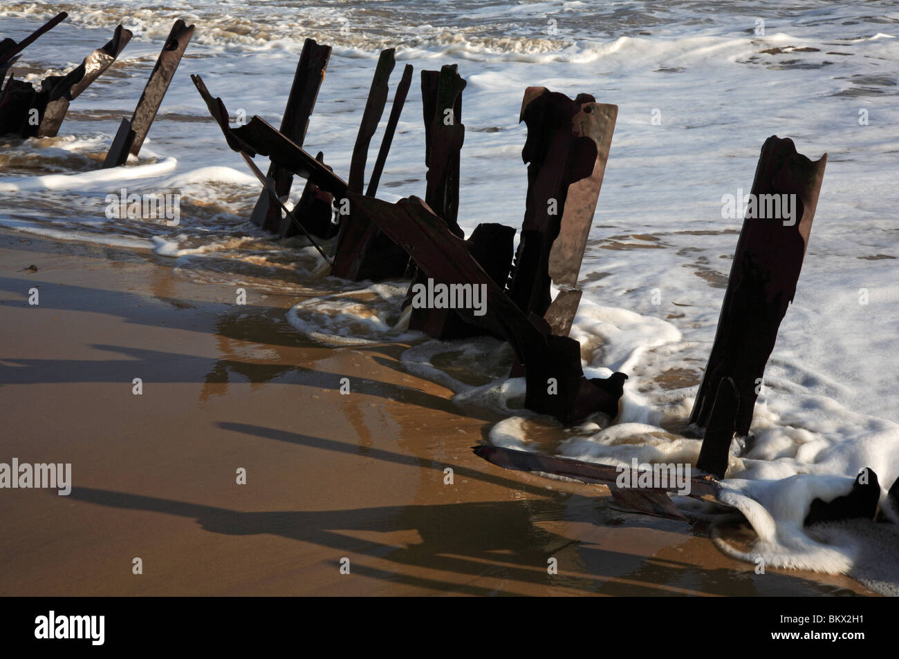 Old steel piling of abandoned groynes at Happisburgh, Norfolk, United ...
